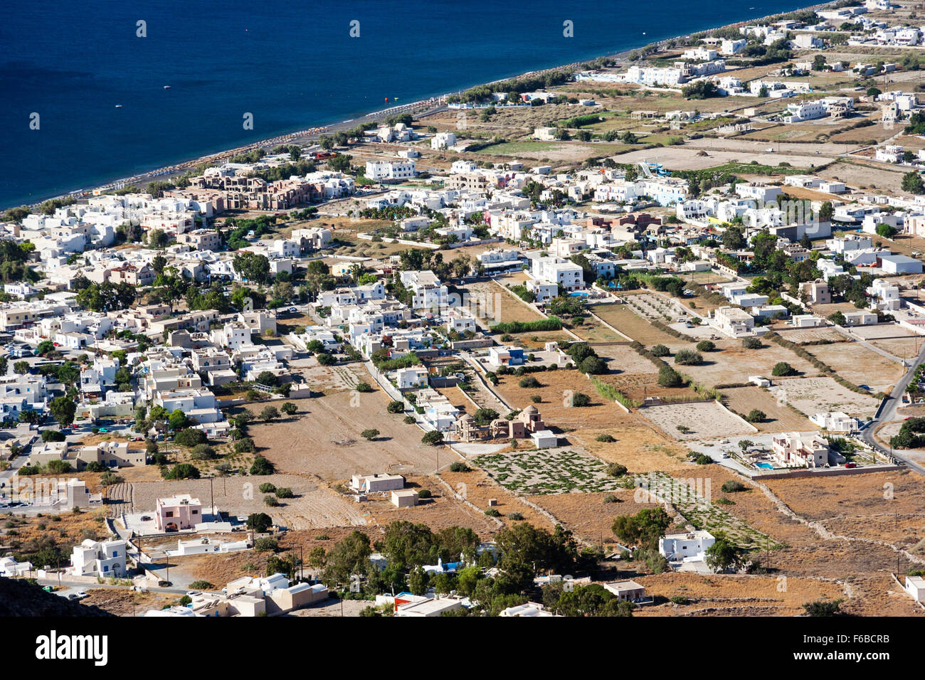 Aerial view, resort beach town Perissa on the popular holiday ...