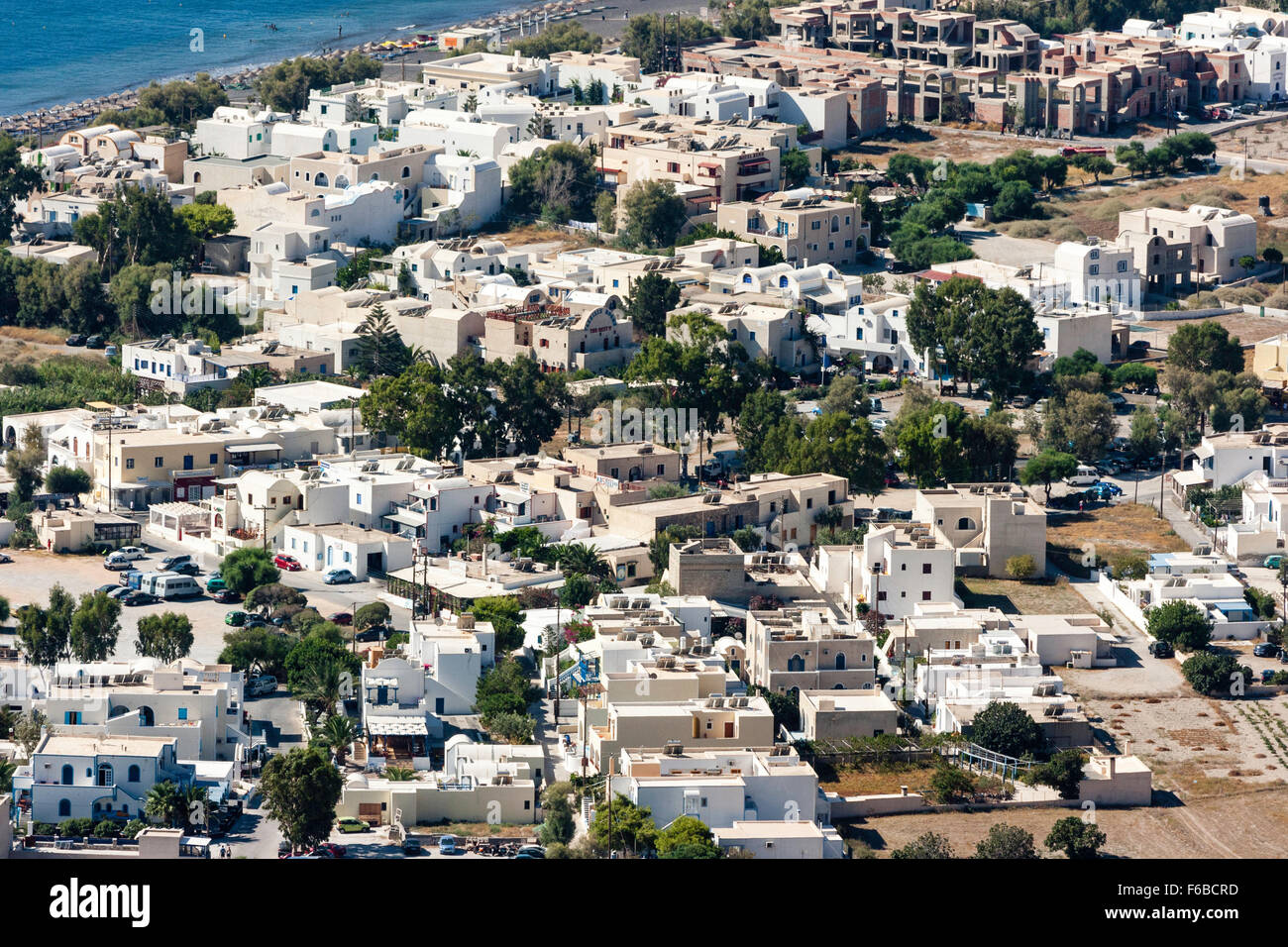 Aerial view, resort beach town Perissa on the popular holiday ...