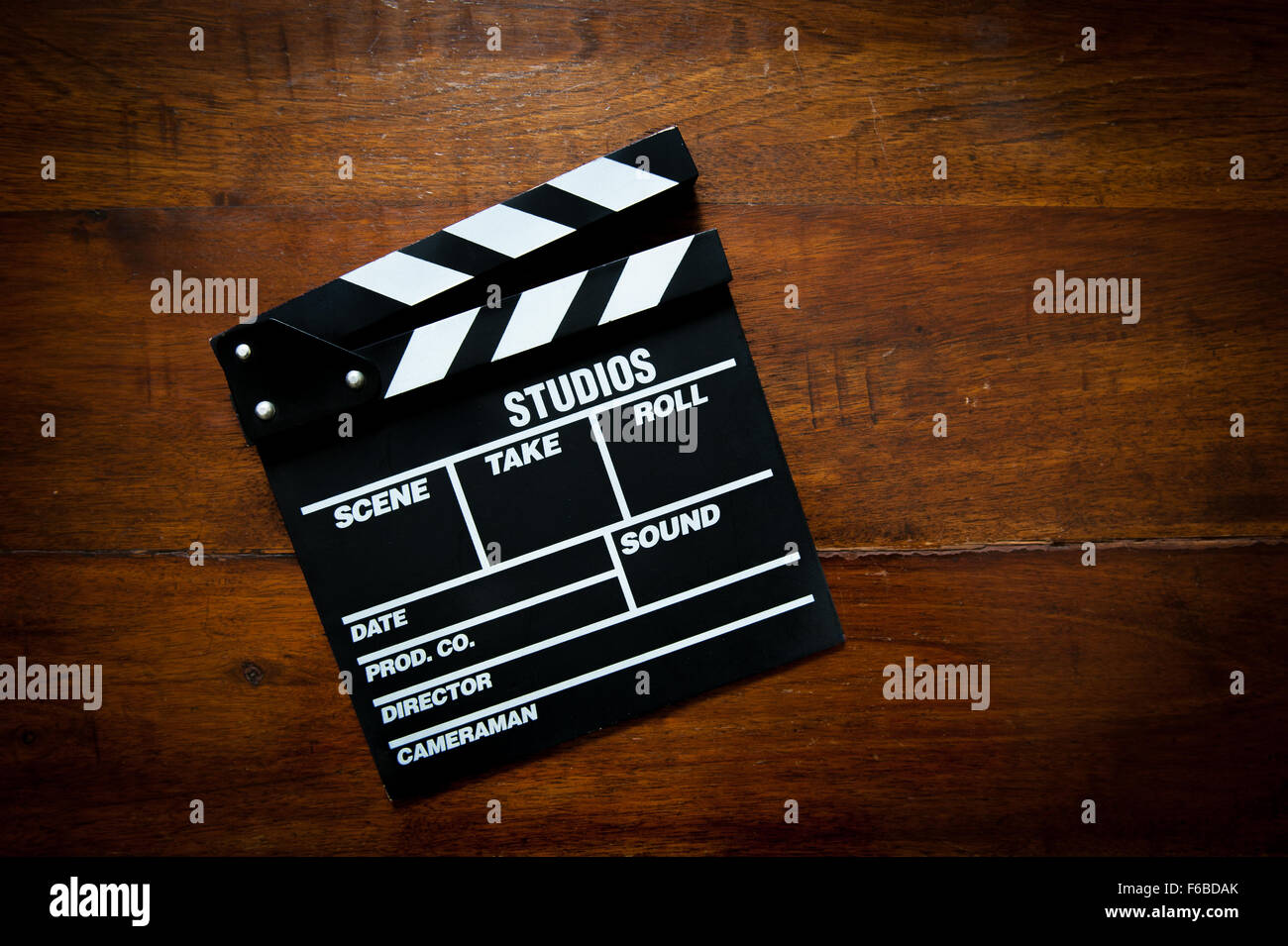 Movie clapper board on wood aged table, movie symbol Stock Photo - Alamy