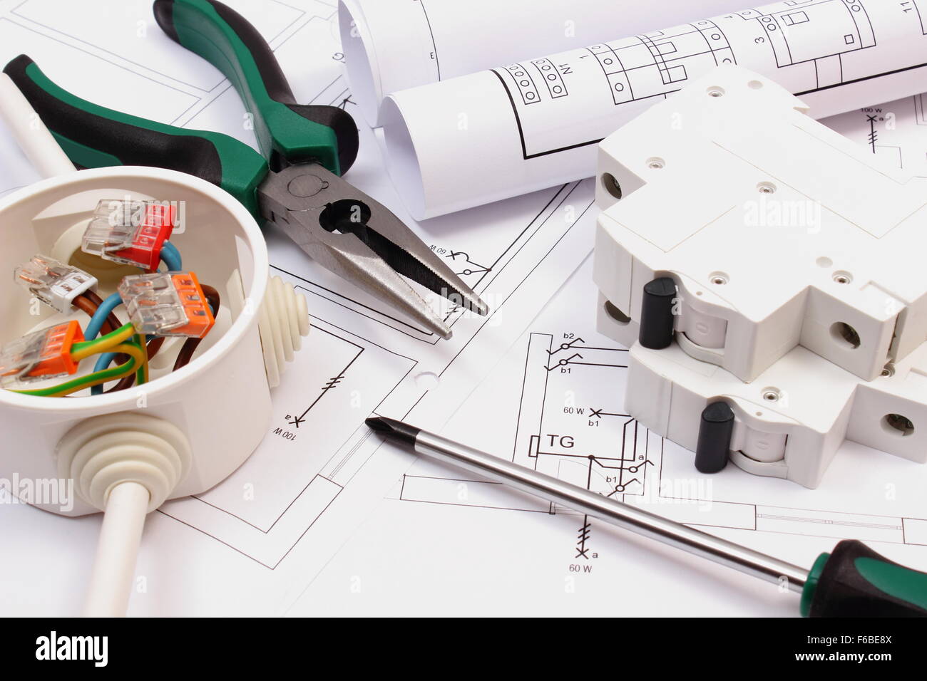 Work tools, cable in electrical box and electric fuse lying on ...