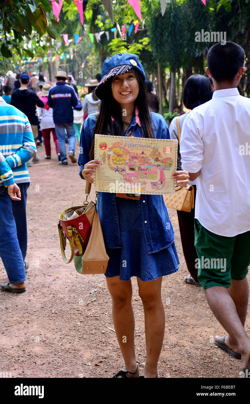 Thai woman show map for touring park at Jim Thompson Farm on December ...