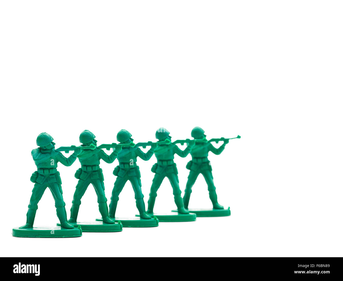 Several plastic soldiers in row, white background Stock Photo - Alamy