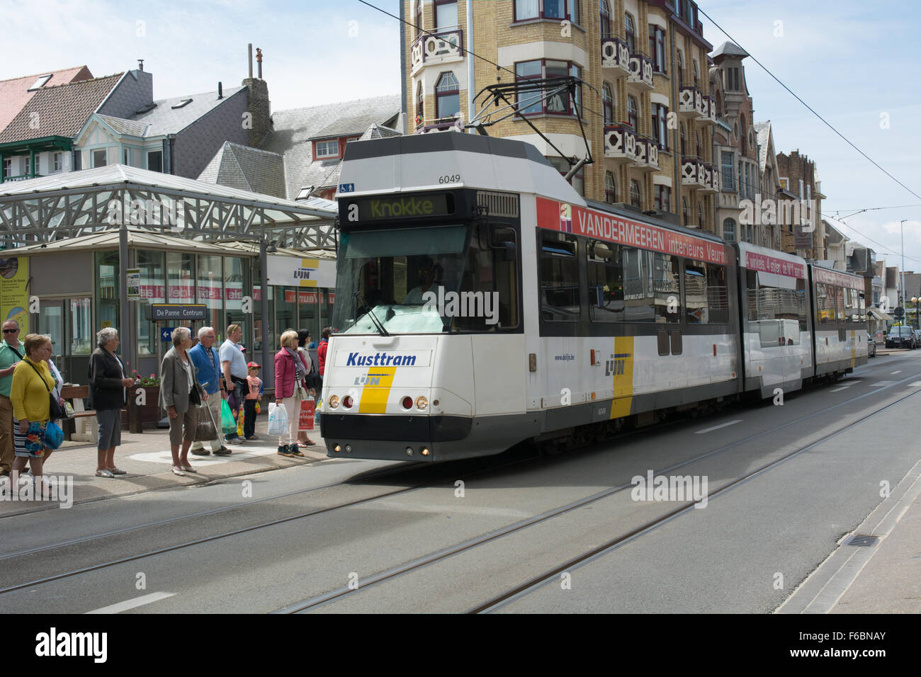 A Kusttram operated by De Lijn picks up passengers in De Panne before ...