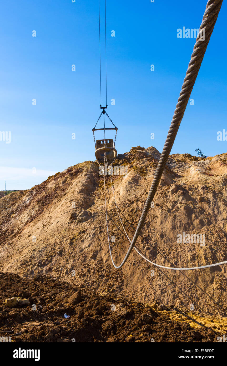 the big dipper dragline excavator digging clay on blue sky background ...