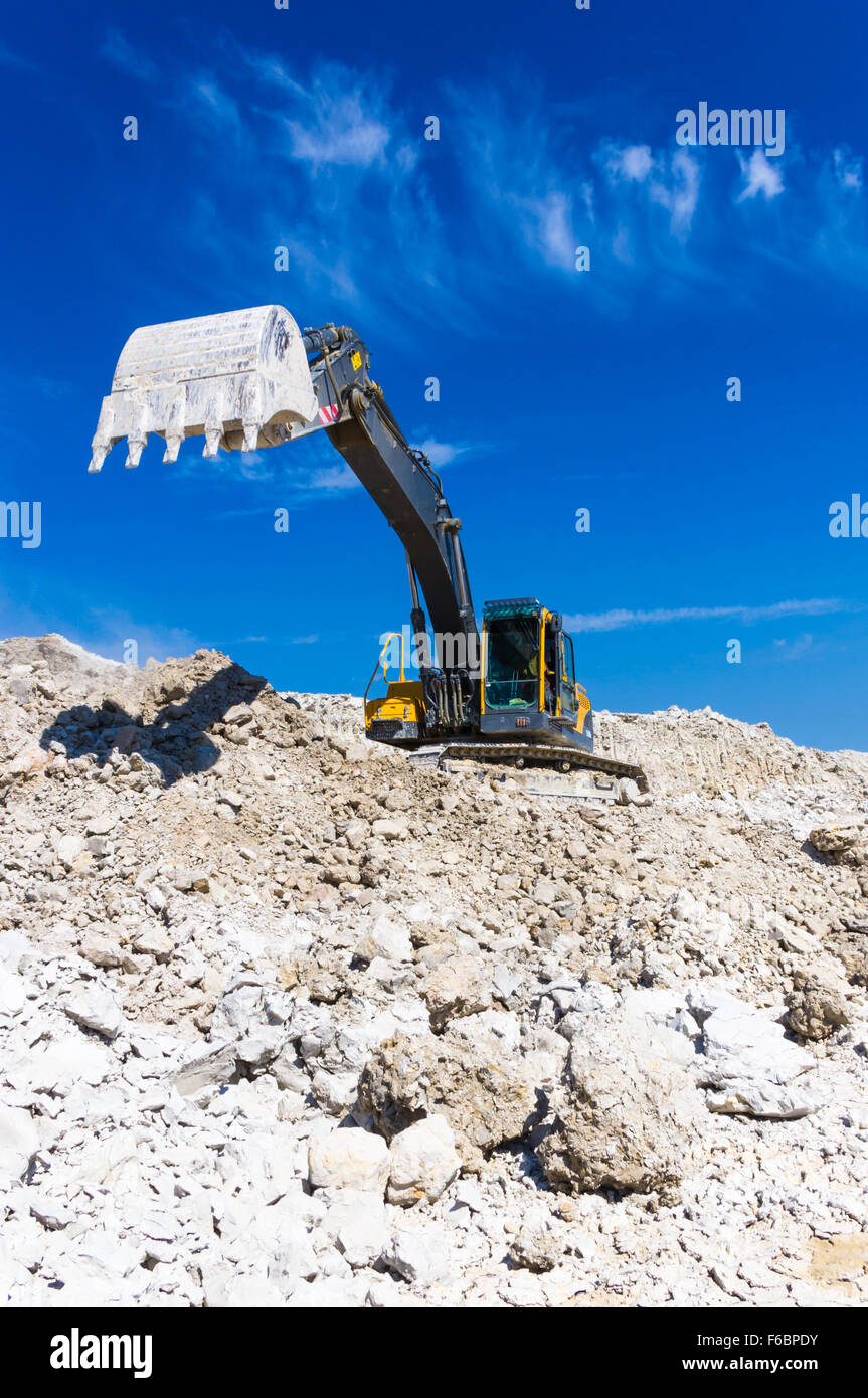 the big dipper dragline excavator digging clay on blue sky background ...