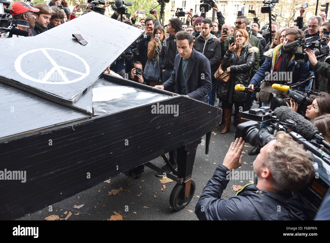 Pianist Davide Martello plays the song 'Imagine' in front of the music ...