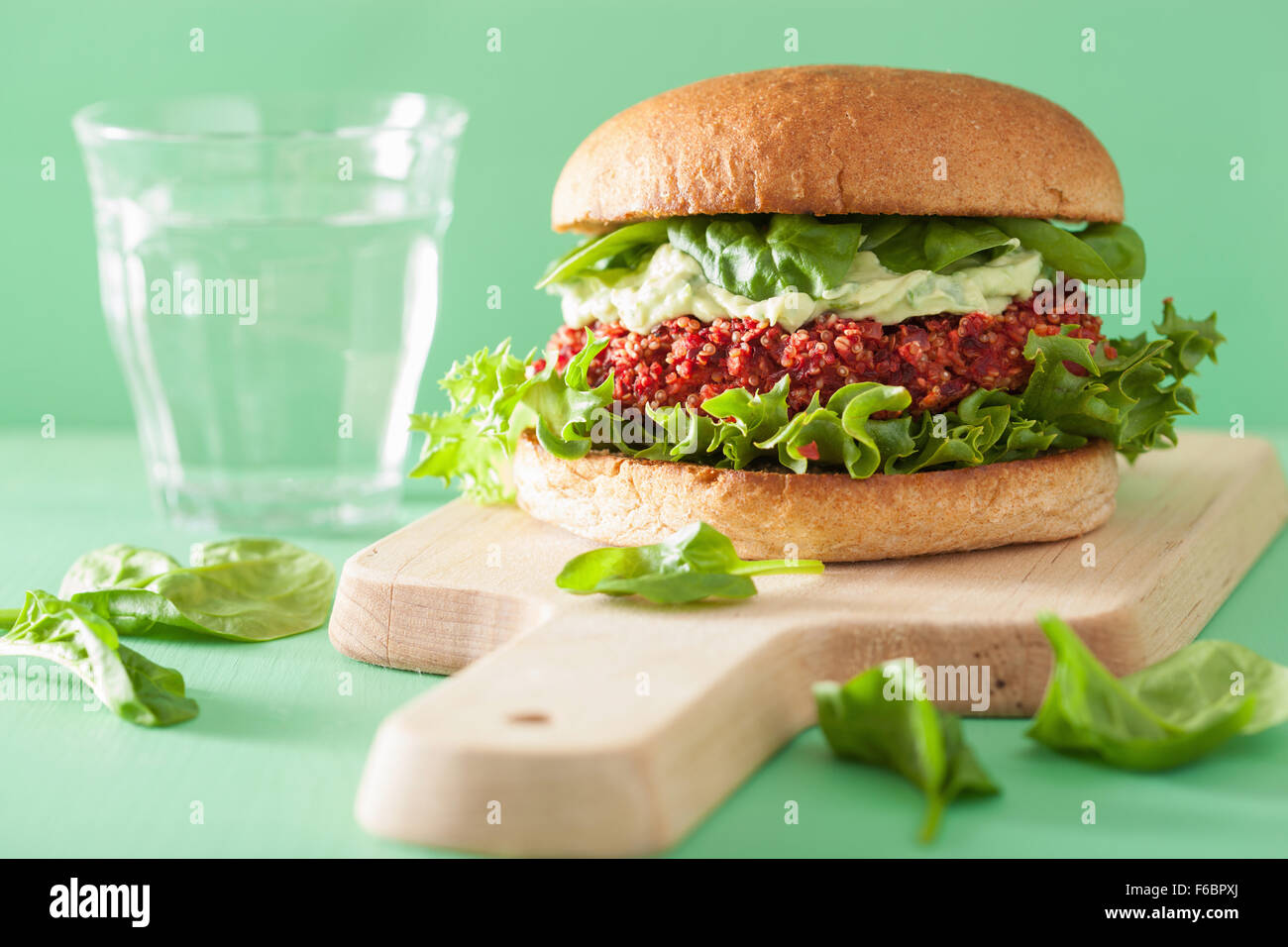 veggie beet and quinoa burger with avocado dressing Stock Photo - Alamy