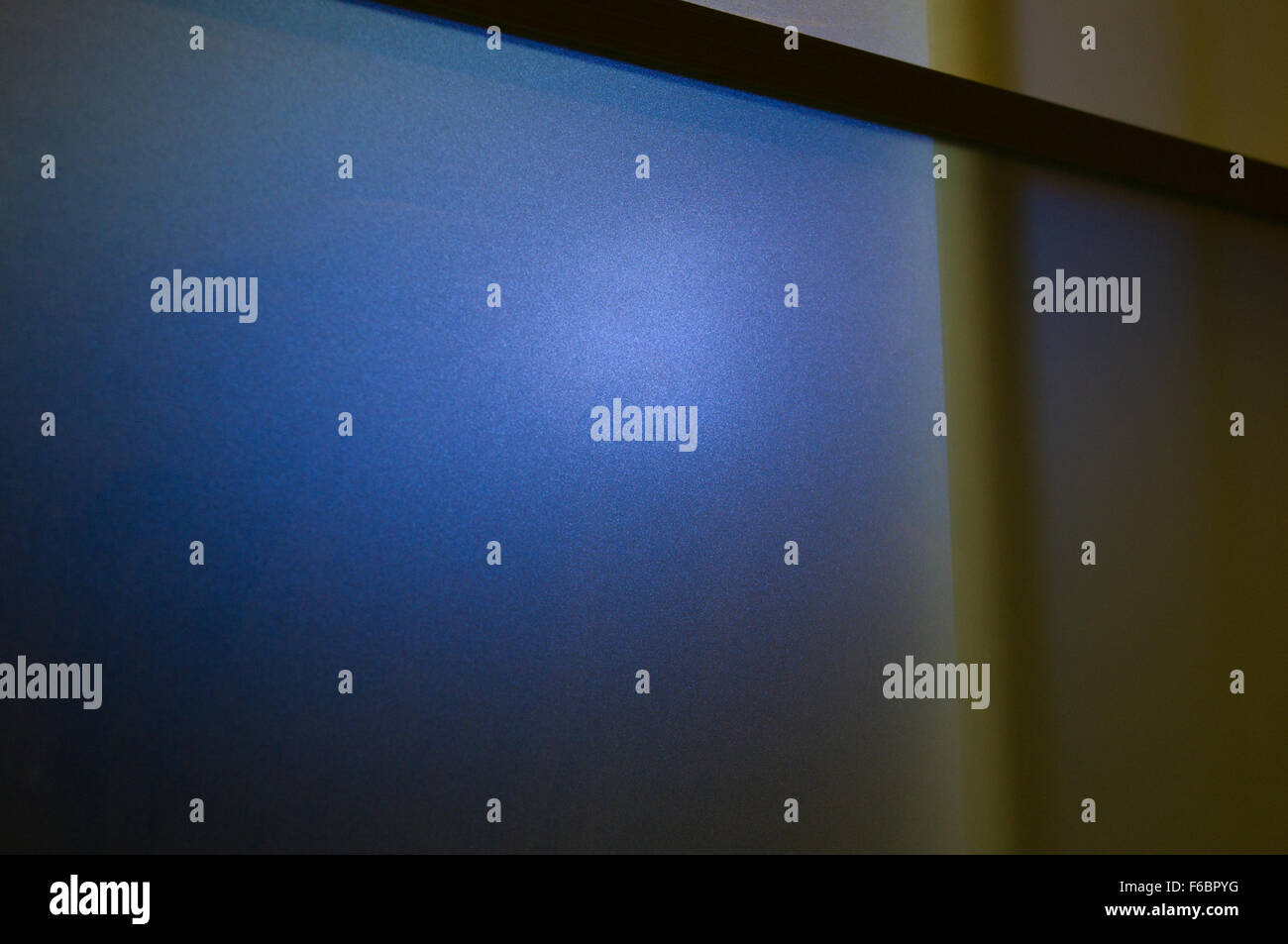 semi-transparent matte glass pane with colored lights, abstract ...