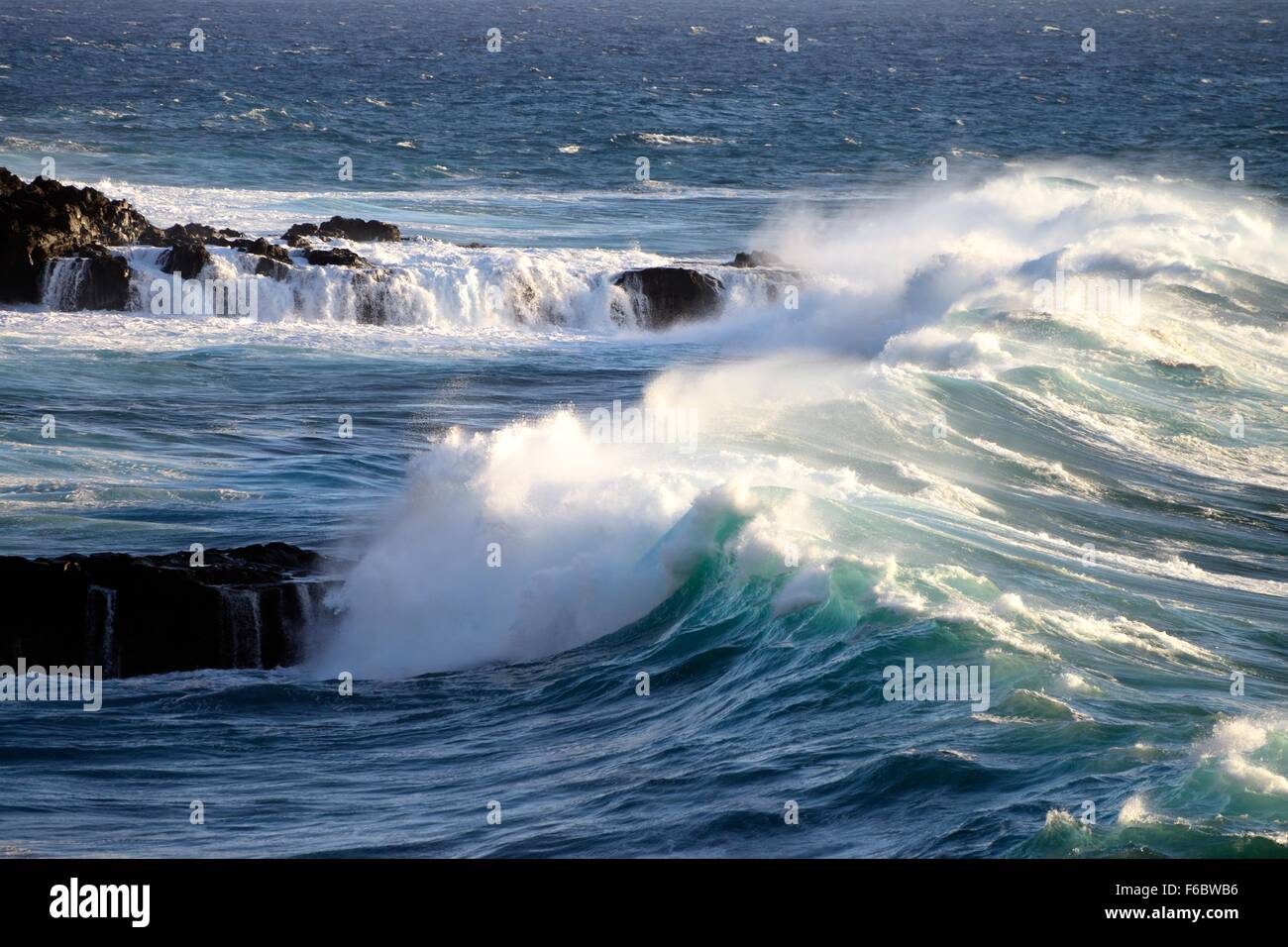 wave breaking rock Stock Photo - Alamy