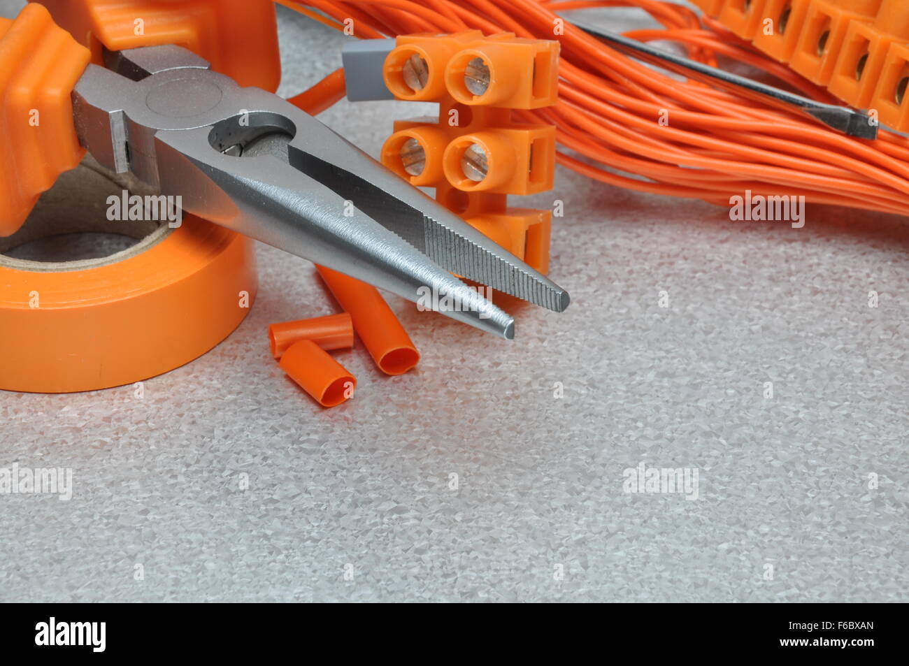 Set of electrical tools and cables on metal surface with place for text ...