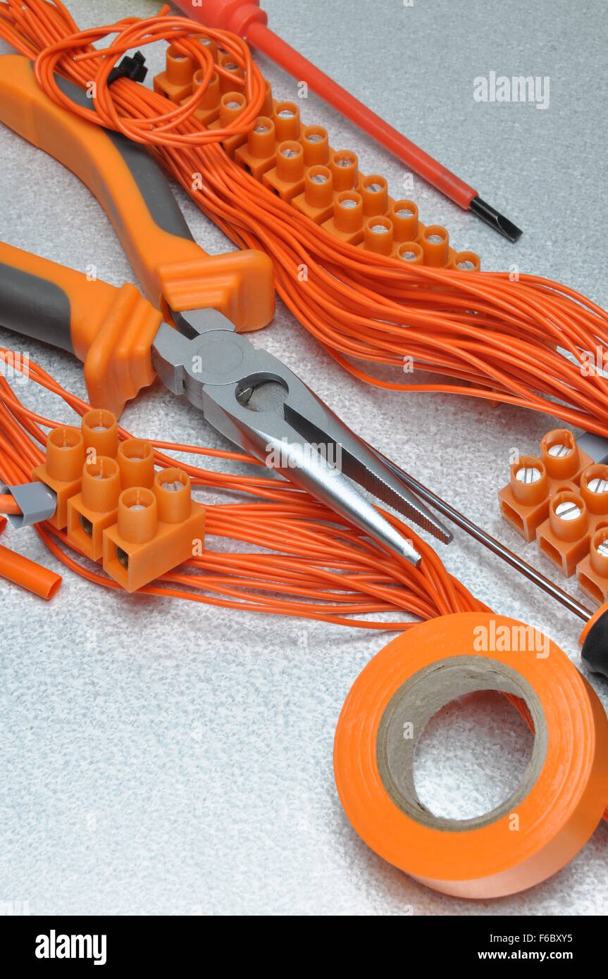 Set of electrical tools and cables on metal surface with place for text ...