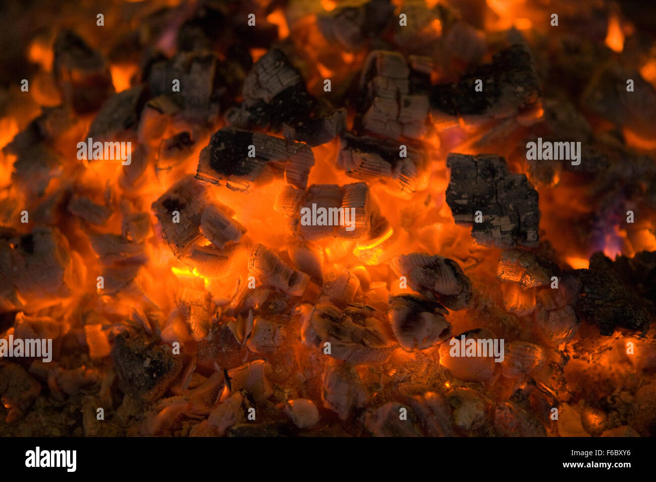 Logs, wood burning on what could be described as a funeral pyre in some ...