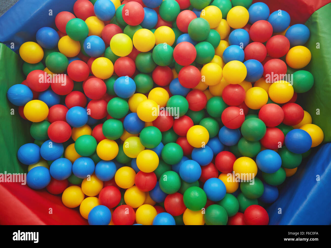 Group of many multicolored plastic balls. Close-up view Stock Photo - Alamy