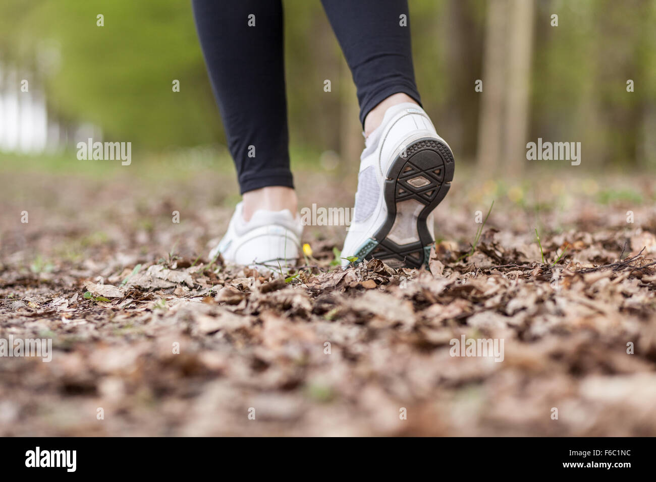 Feet of a running woman Stock Photo - Alamy