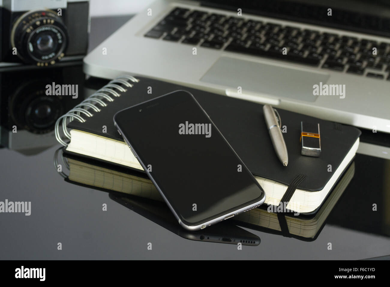 Office table with laptop, phone and supplies Stock Photo - Alamy