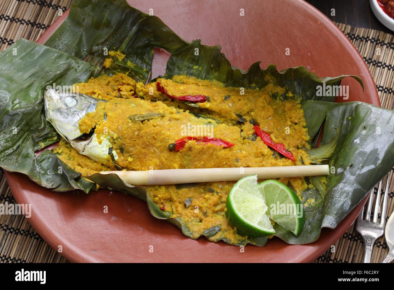 ikan pepes, indonesian cuisine, steamed fish wrapped in banana leaves ...