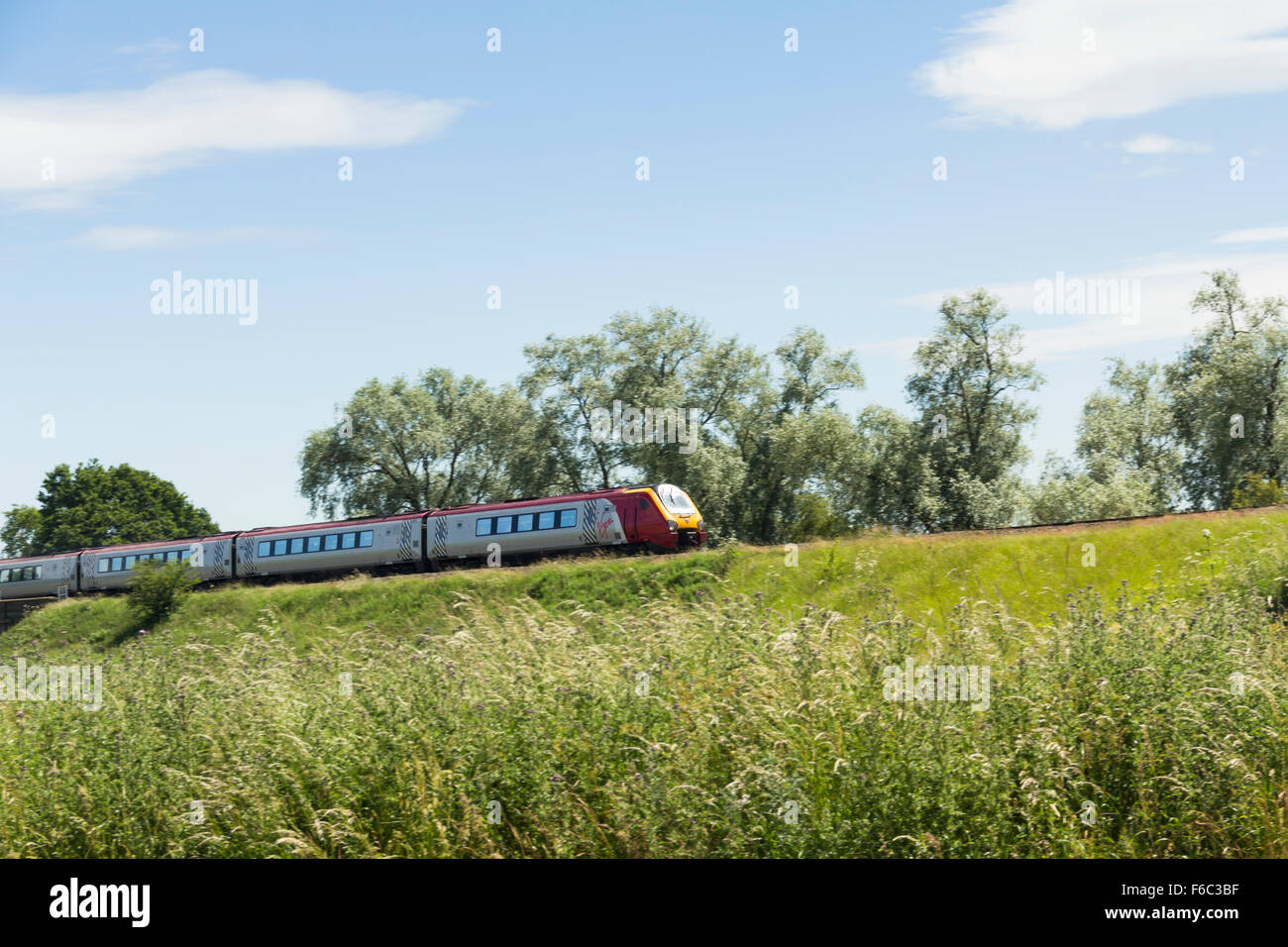 A Virgin Voyager four coach express train passes though open ...