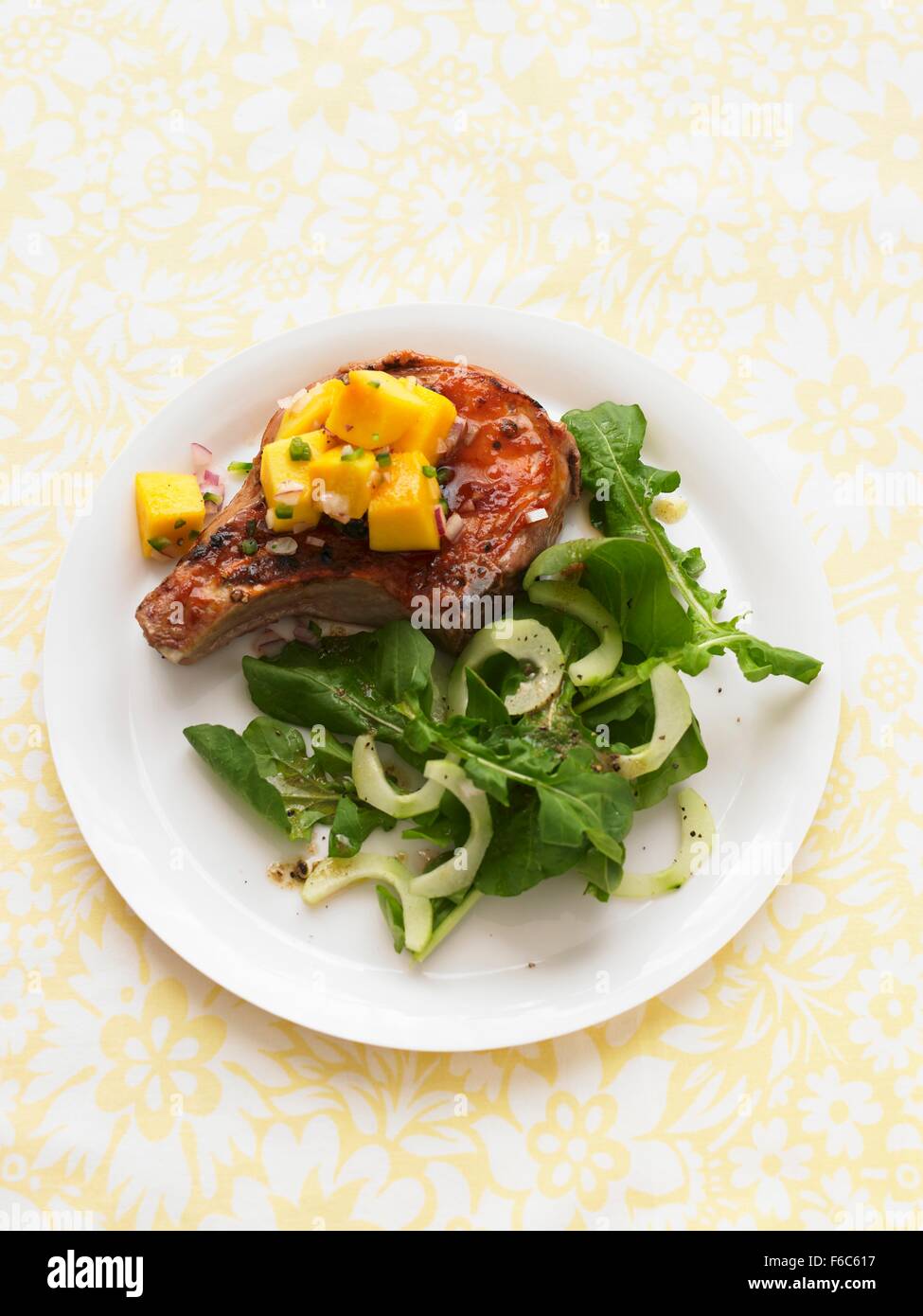 A pork chops with mango salsa Stock Photo - Alamy