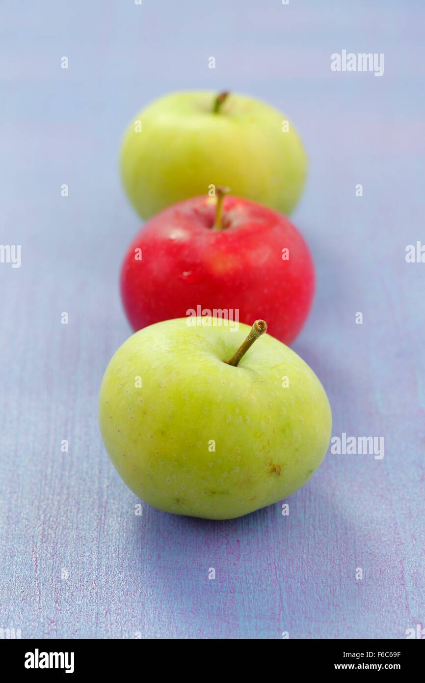 Three apples (two green, one red Stock Photo - Alamy