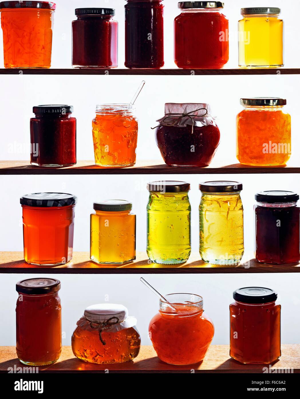 Assorted jars of jam on wooden shelves Stock Photo - Alamy