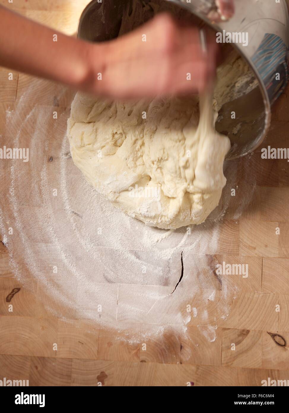 Making Bread; Dumping Dough from Pan onto Floured Surface Stock Photo ...