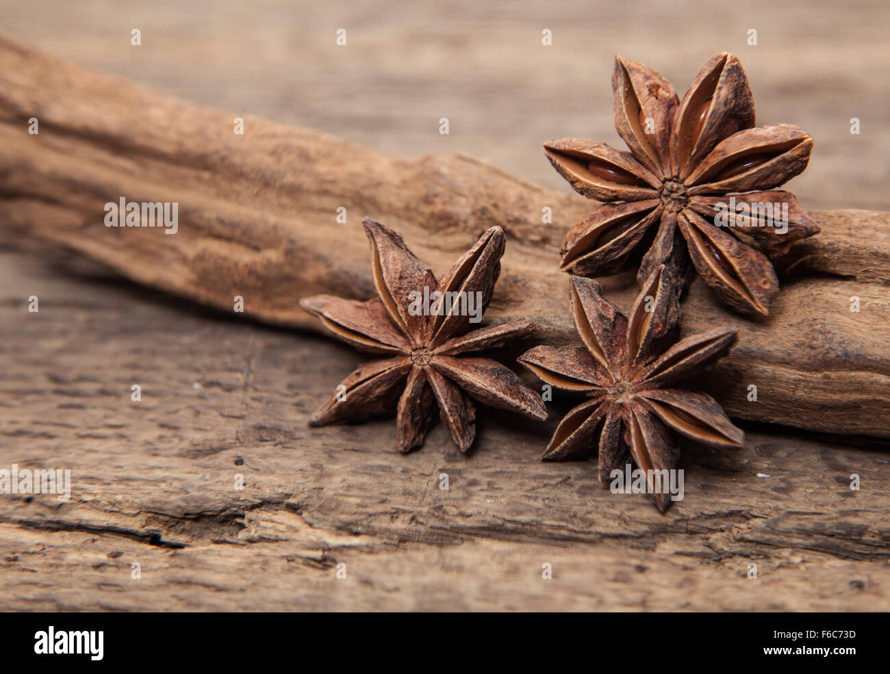 Fine star anis on wooden background Stock Photo - Alamy