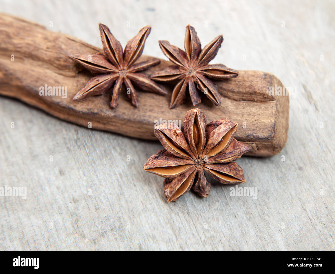Fine star anis on wooden background Stock Photo - Alamy