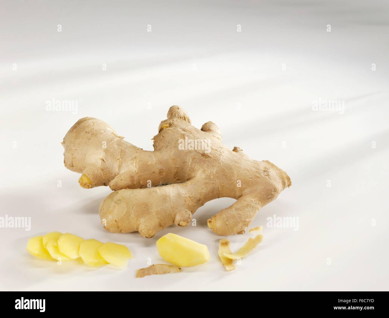Ginger root with a piece and slices of ginger Stock Photo - Alamy