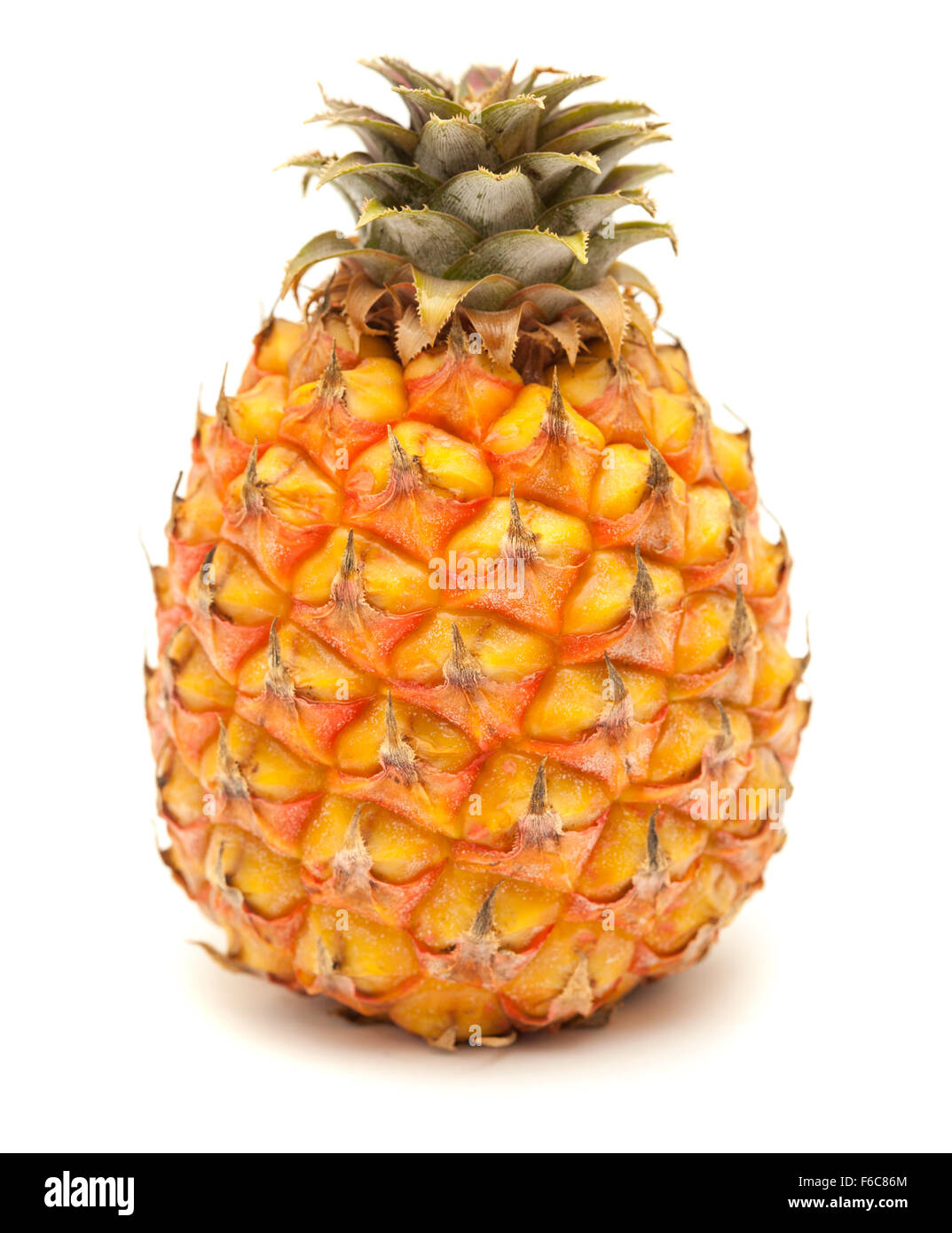 small ripe red and yellow pineapple isolated on white background Stock ...