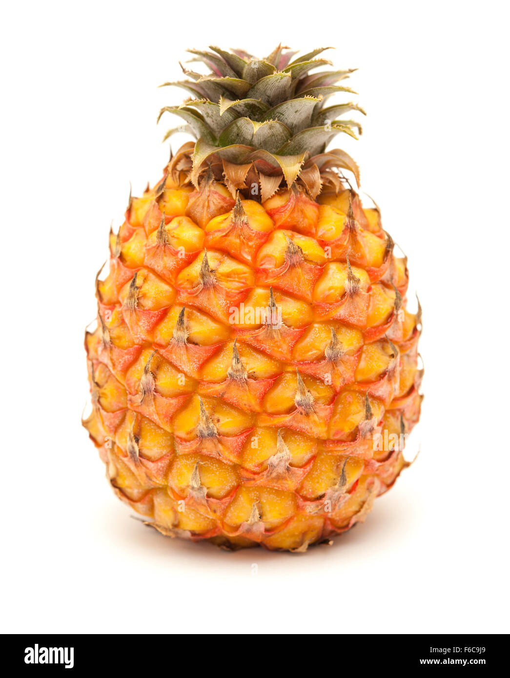 small ripe red and yellow pineapple isolated on white background Stock ...