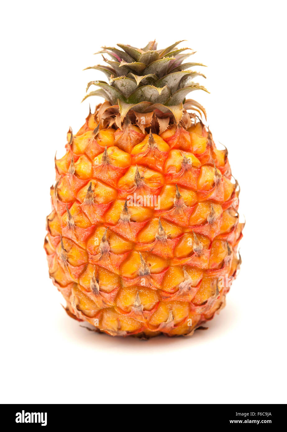 small ripe red and yellow pineapple isolated on white background Stock ...