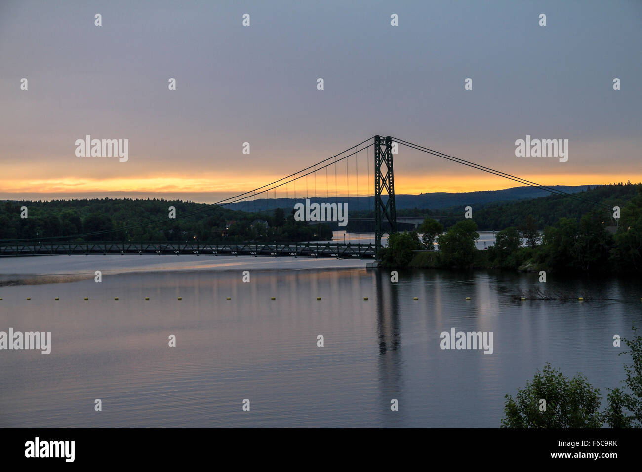 Bridge over Lake at sunset Stock Photo - Alamy