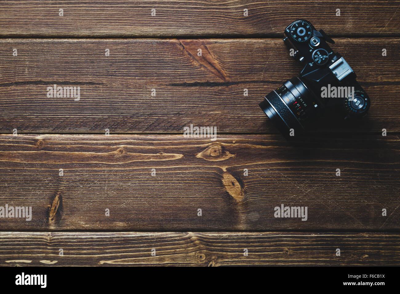 Old camera on wooden table Stock Photo - Alamy