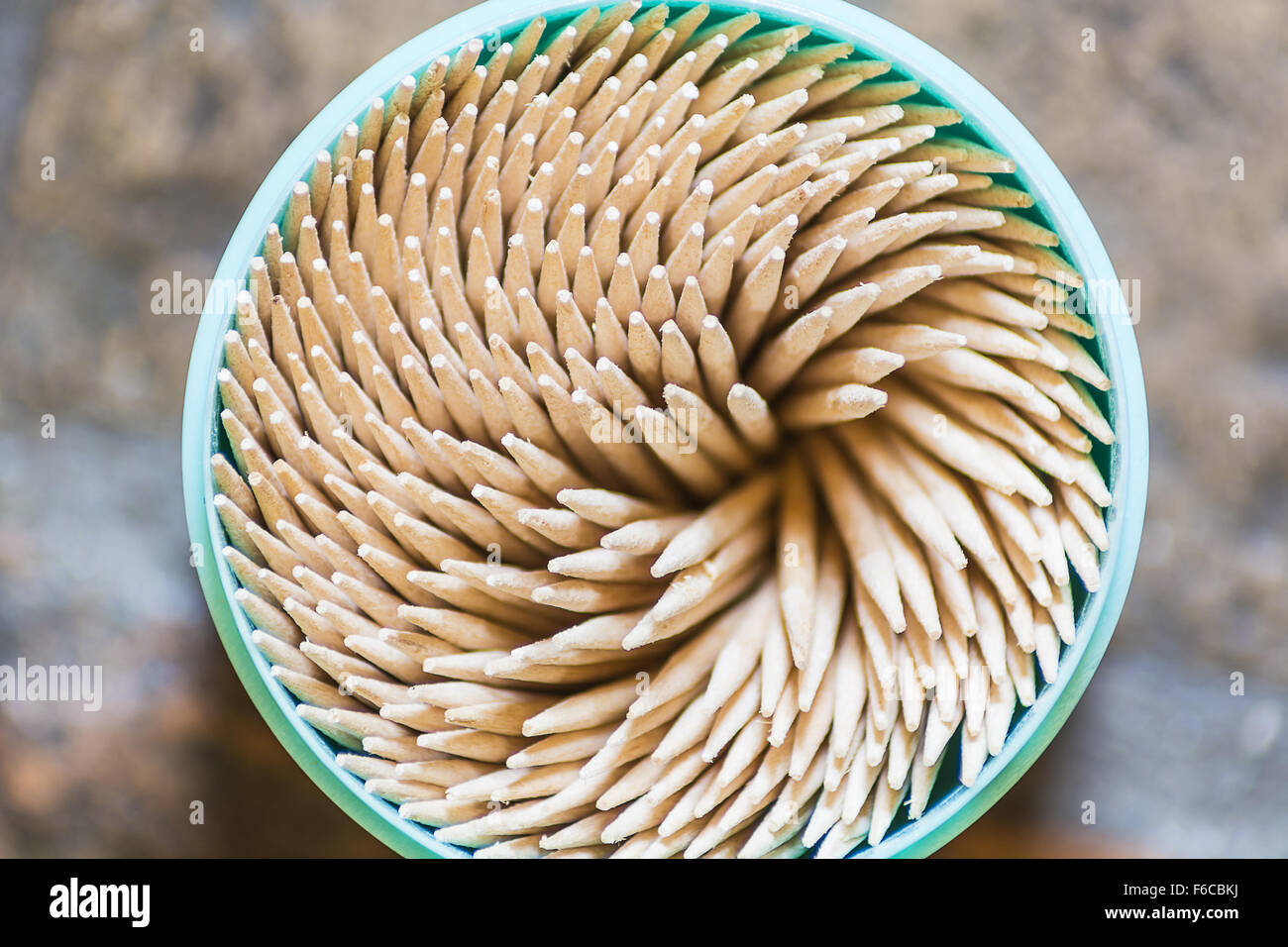 a bunch of toothpicks in a round box Stock Photo - Alamy
