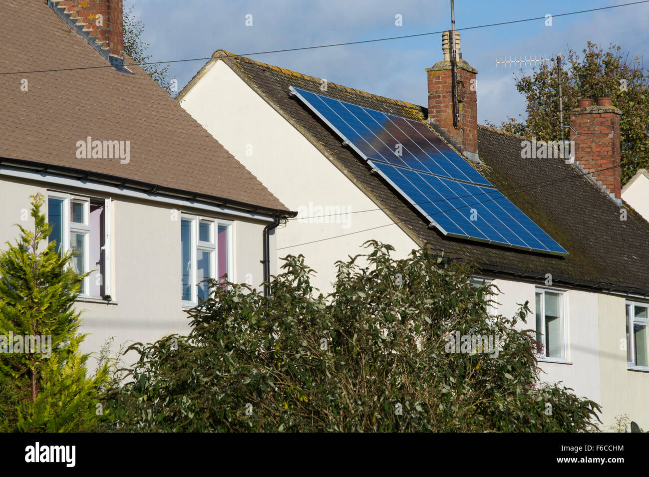 Solar panels on the roof tops of housing in the UK Stock Photo - Alamy