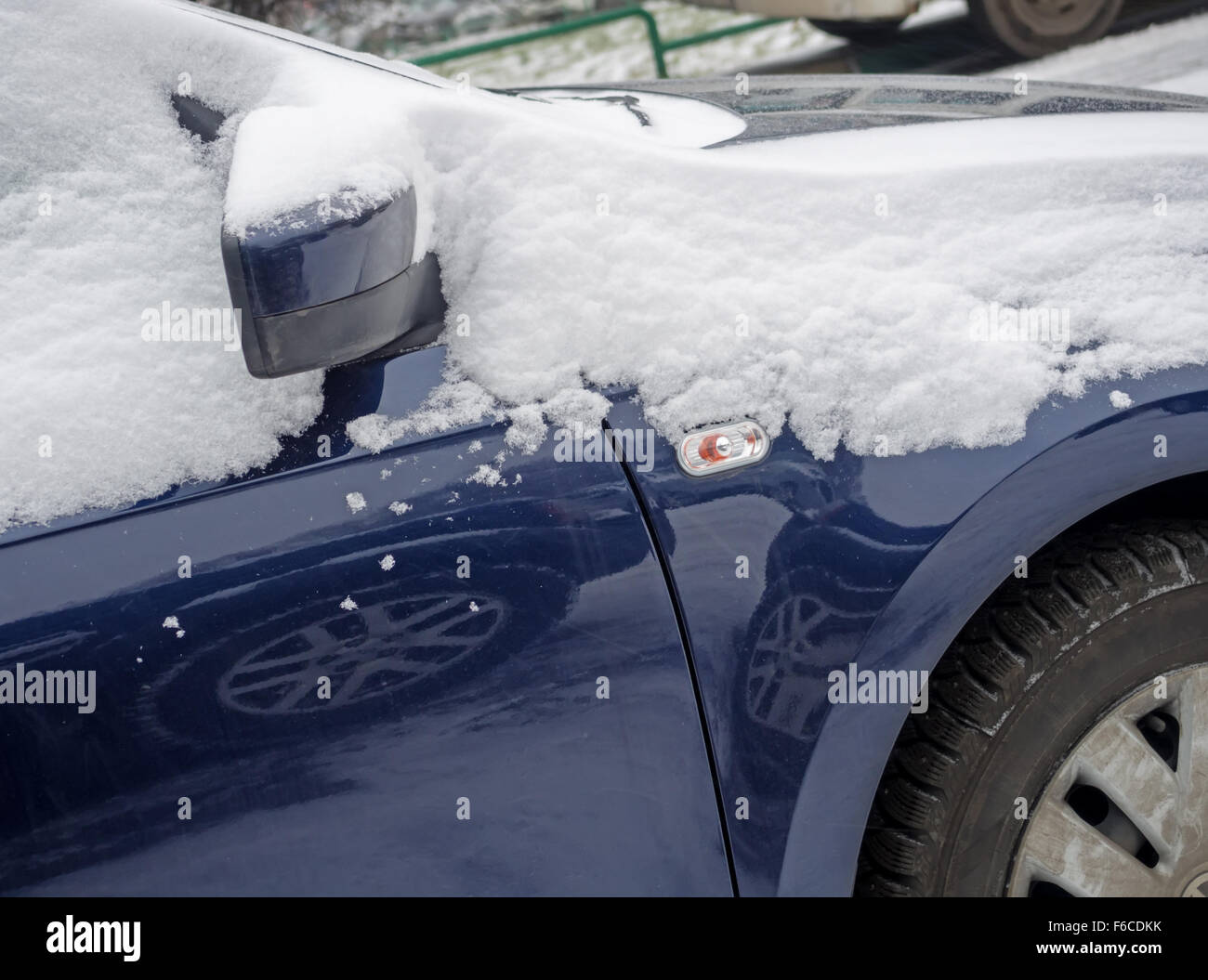 First days ow the winter - Snow covered blue car Stock Photo - Alamy