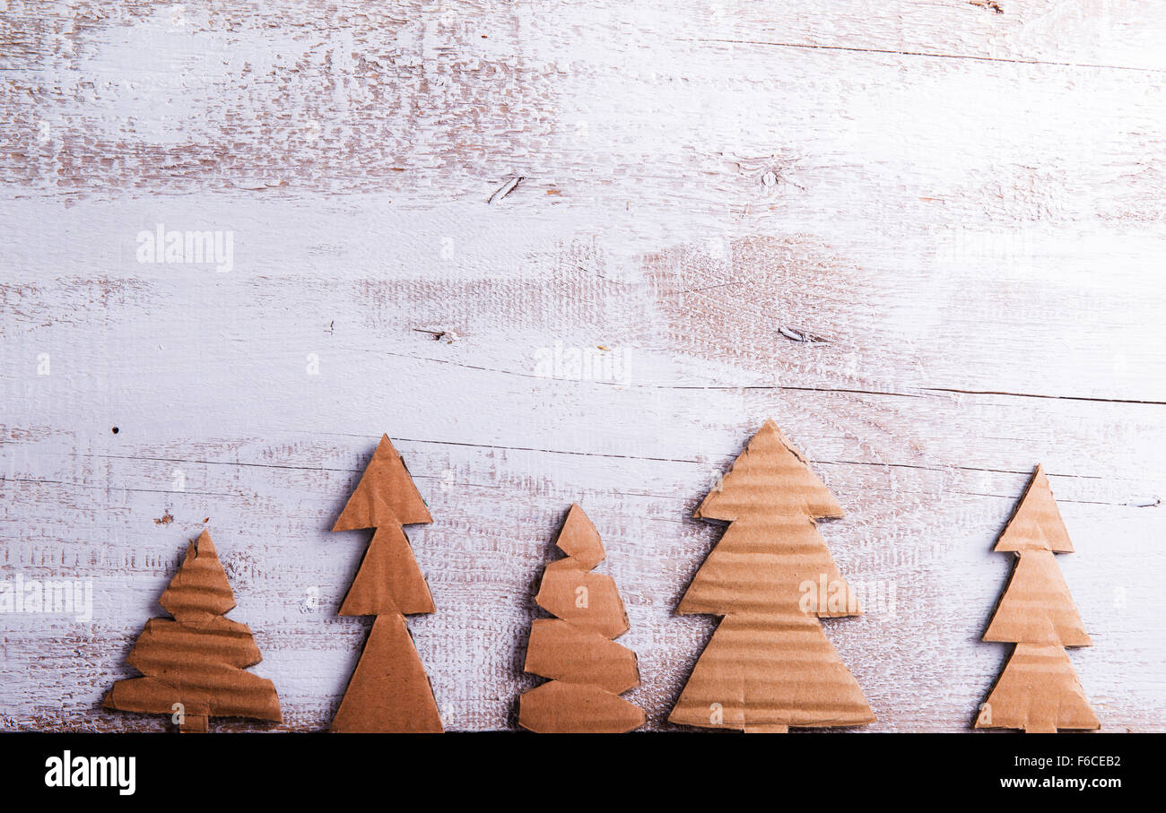 Carton trees on wooden background Stock Photo - Alamy