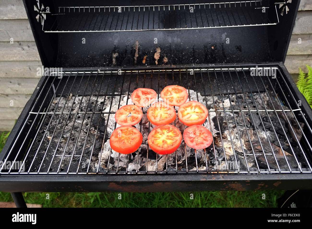 Stages of a drum type barbecue Stock Photo - Alamy
