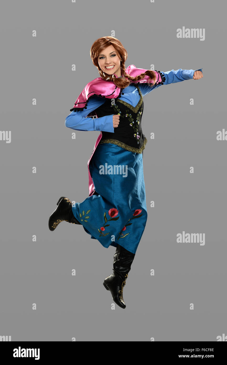 Beautiful young woman dressed in vintage costume jumping isolated over ...