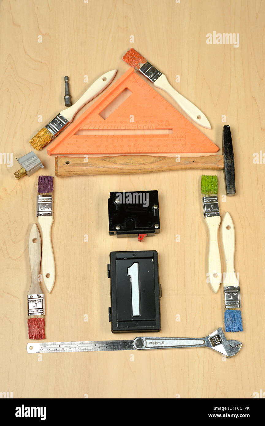 House made out of tools over wooden table Stock Photo - Alamy