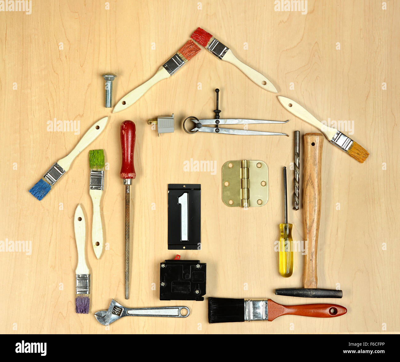 House made out of tools over wooden surface Stock Photo - Alamy
