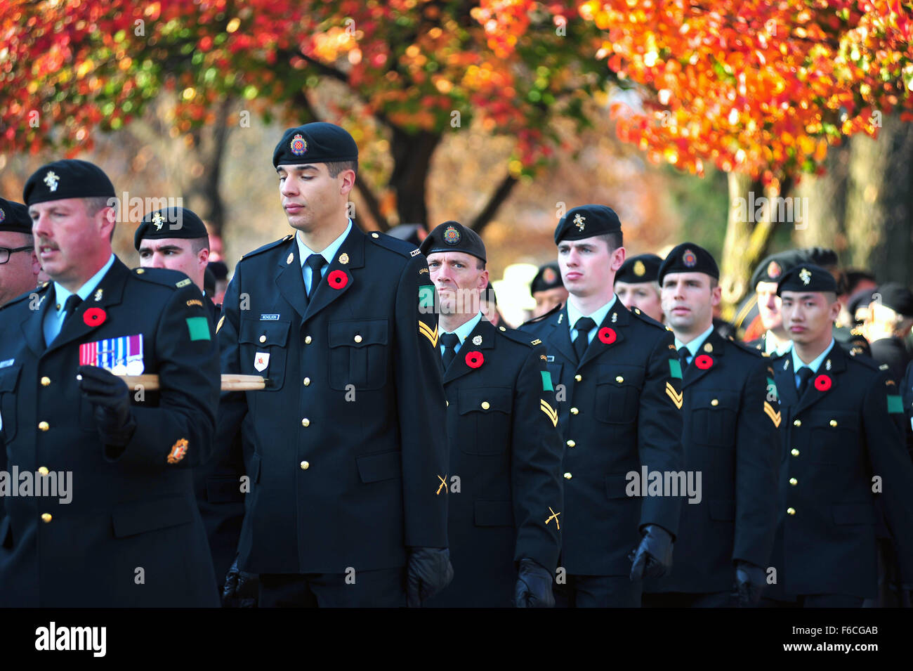 Canadian serving military personnel parch at the end of a remembrance ...