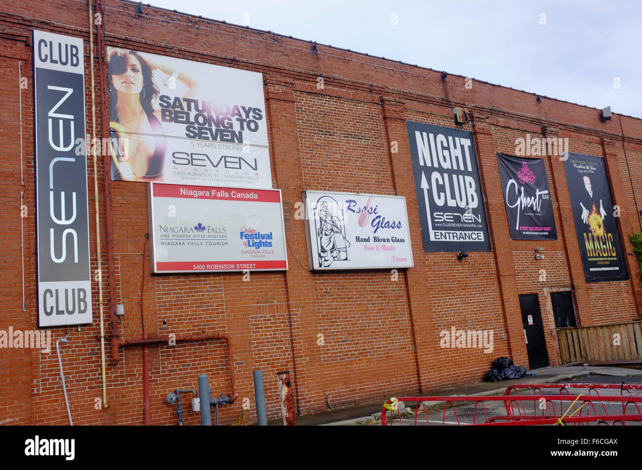 A wall of signs outside clubs in the Canadian city of Niagara Falls in ...