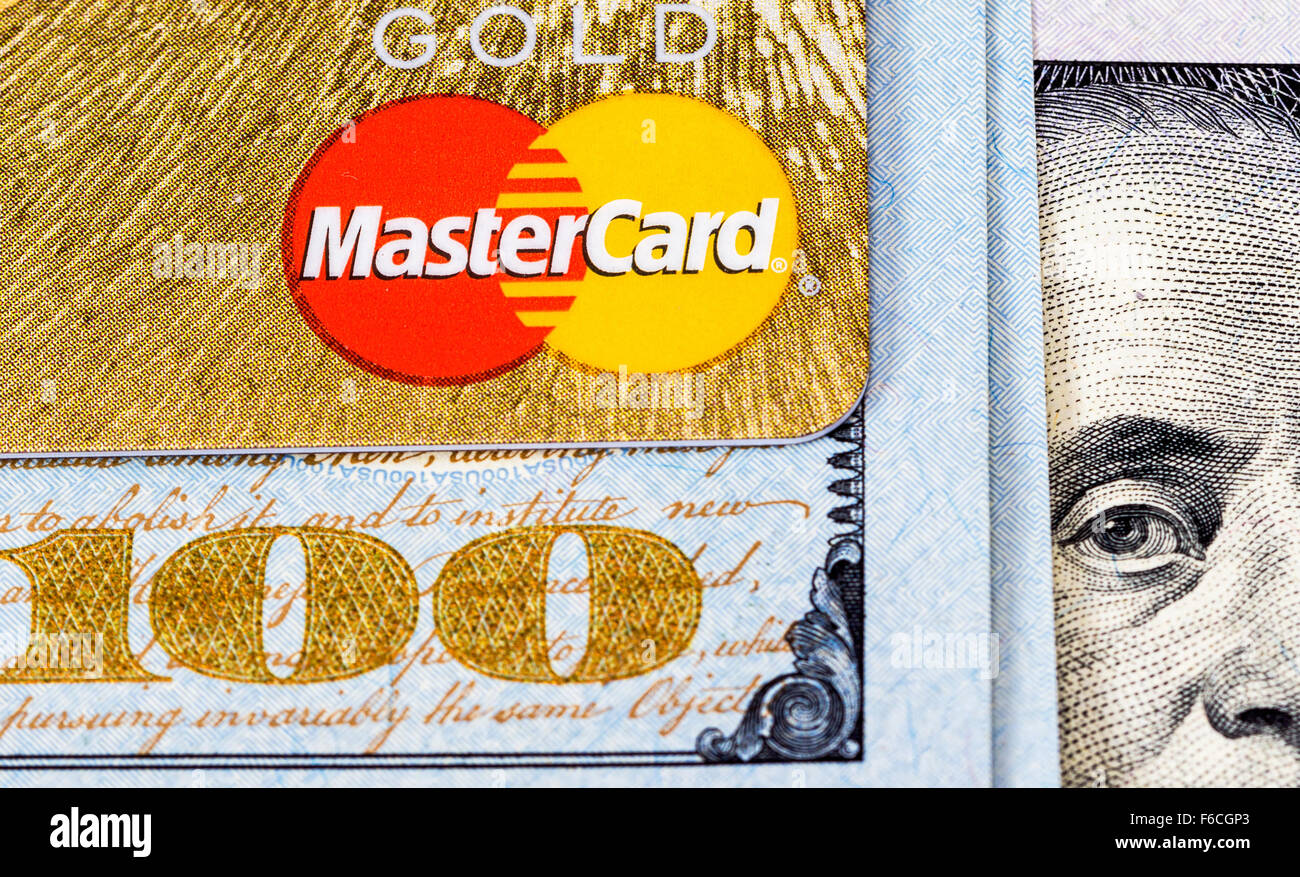 Mastercard Debit Card with US dollar bills Stock Photo - Alamy