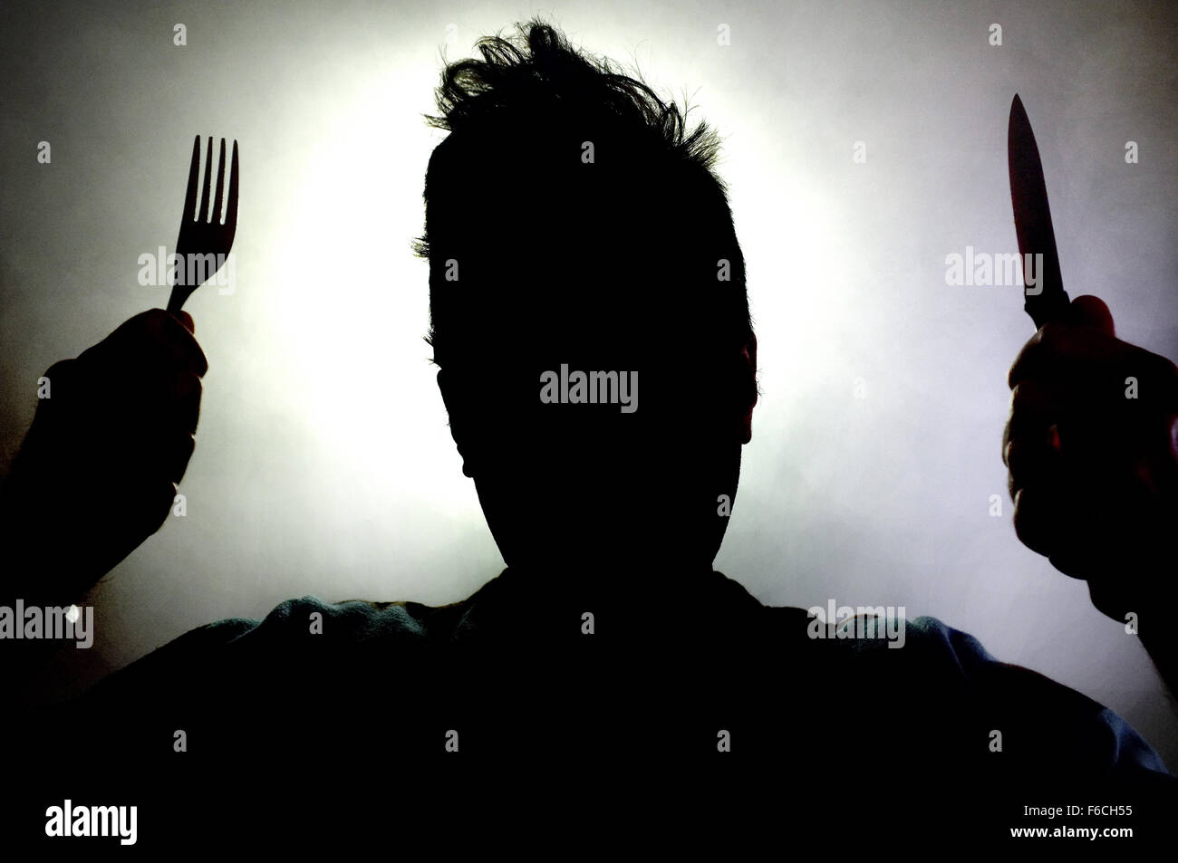 Man holding knife and fork hi-res stock photography and images - Alamy