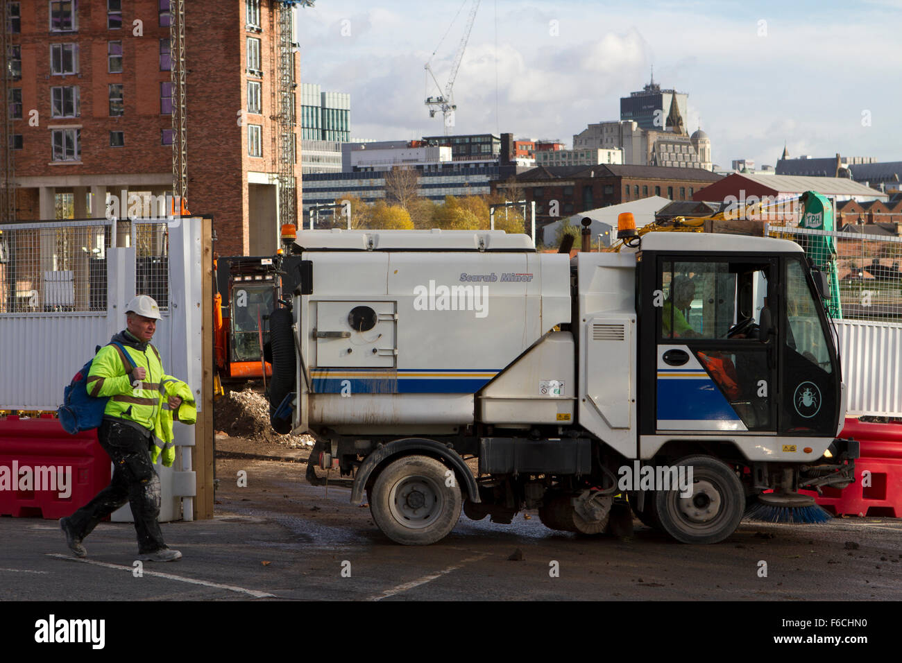 A road sweeper being used for the road clean up outside a construction ...