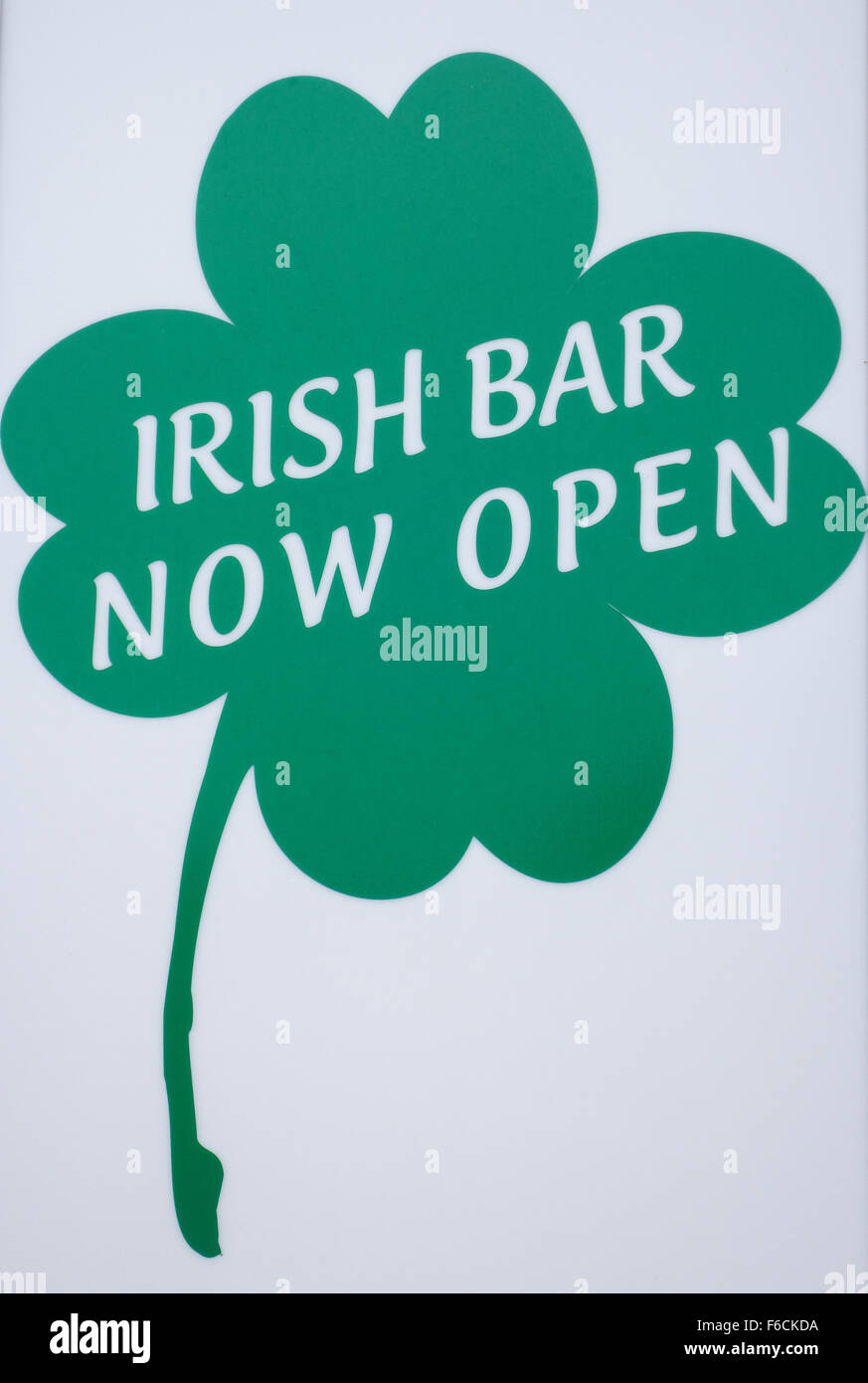 Green 'Irish Bar Now Open' road sign in the shape of a four-leaf clover ...