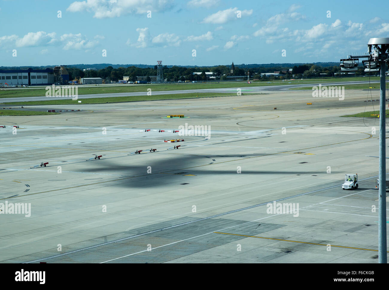 Shadow of a plane passing over the runway at an airport Stock Photo - Alamy