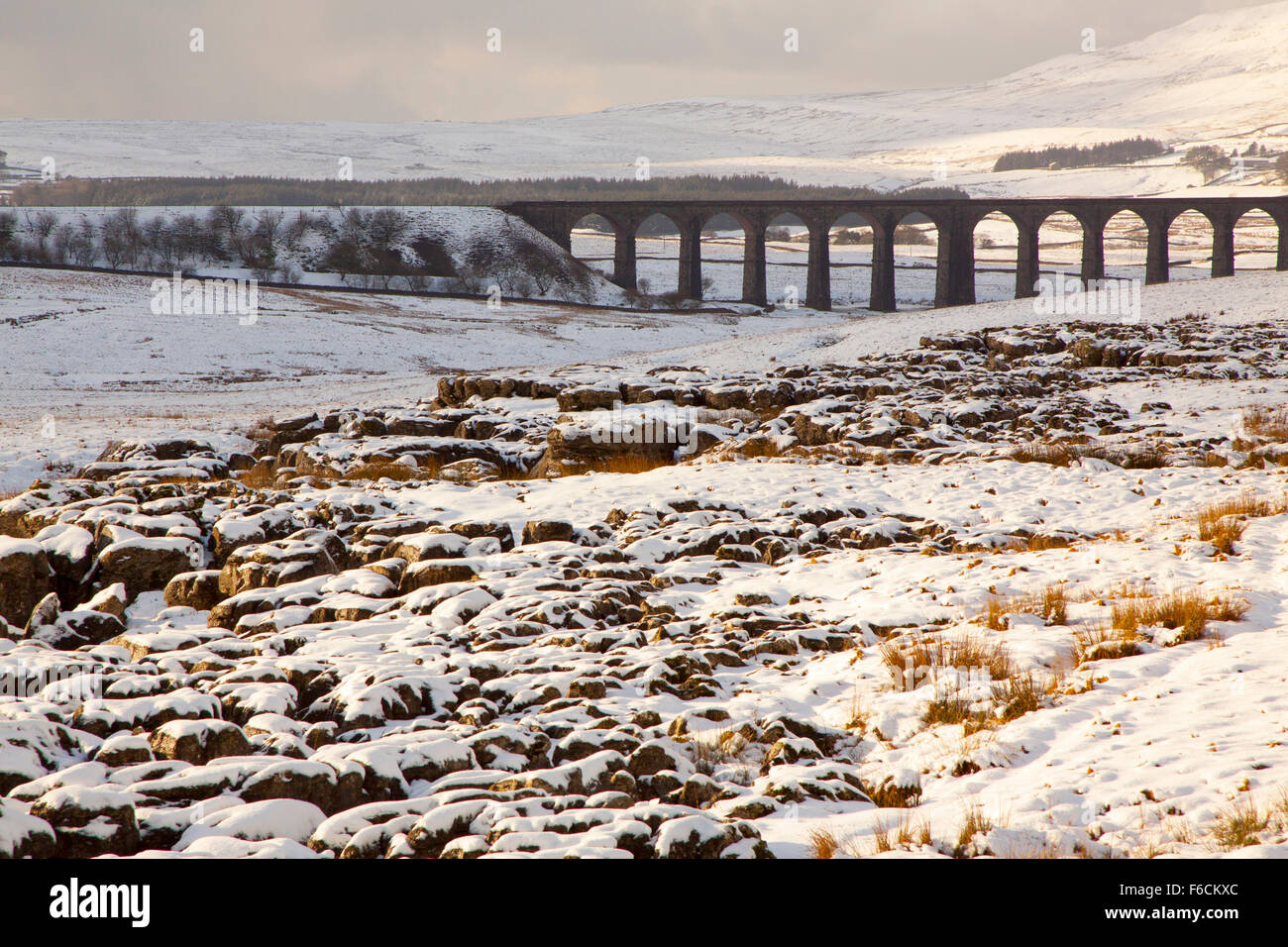 Ribblehead viaduct in the snow, with limestone pavement in foreground ...
