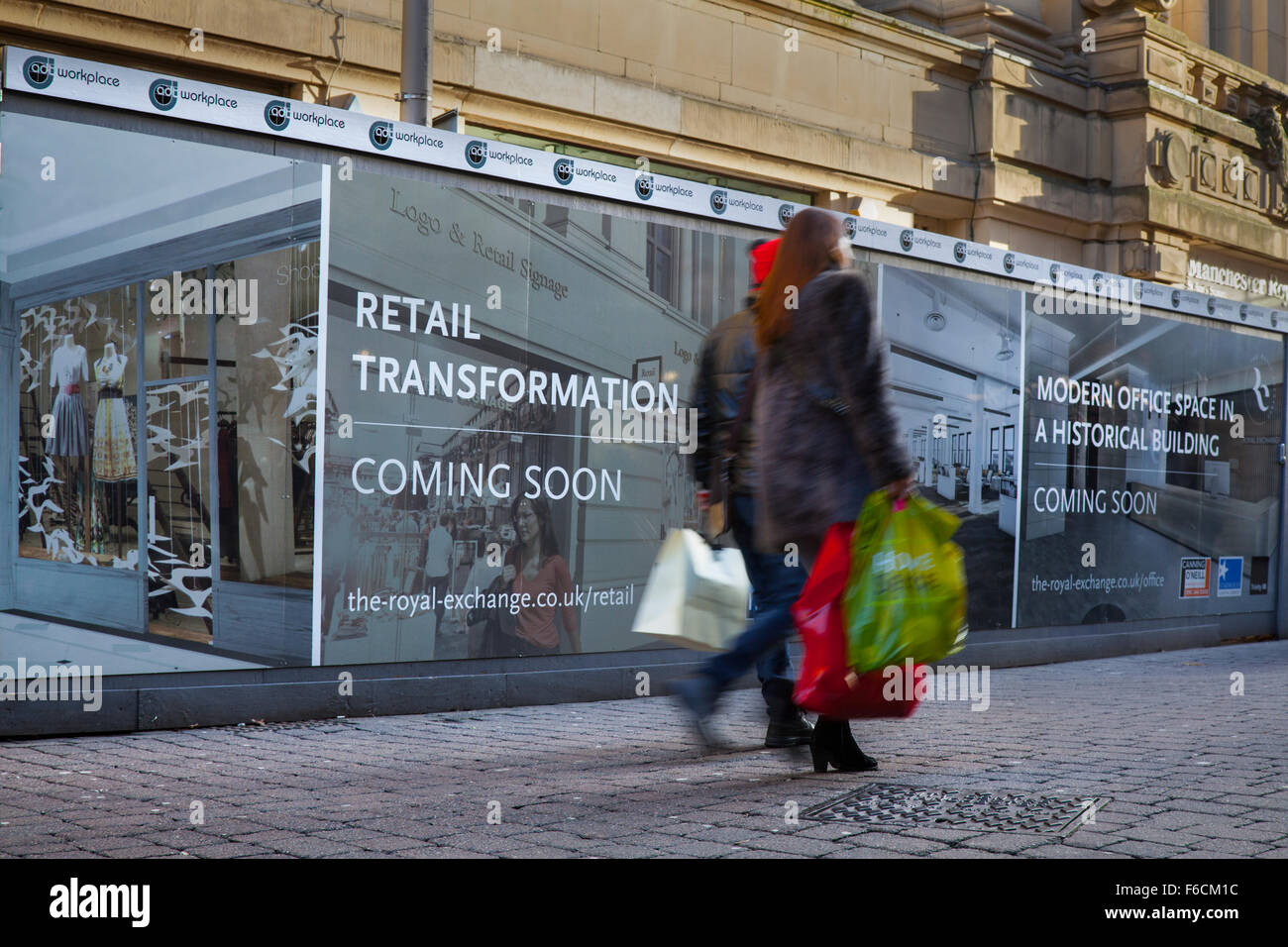 Modern Office space in an historical building. Shoppers passing ...
